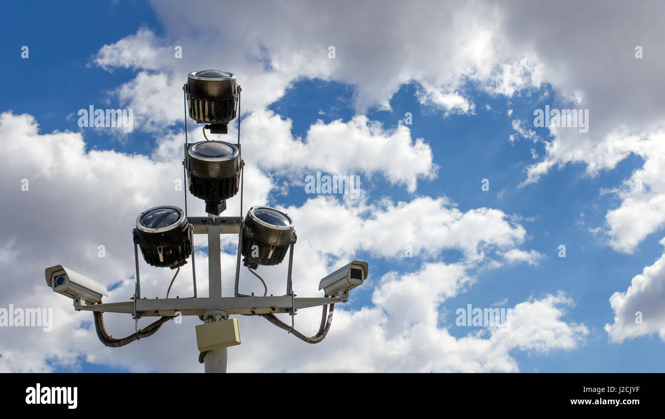 Two security camera on blue sky background Stock Photo - Alamy