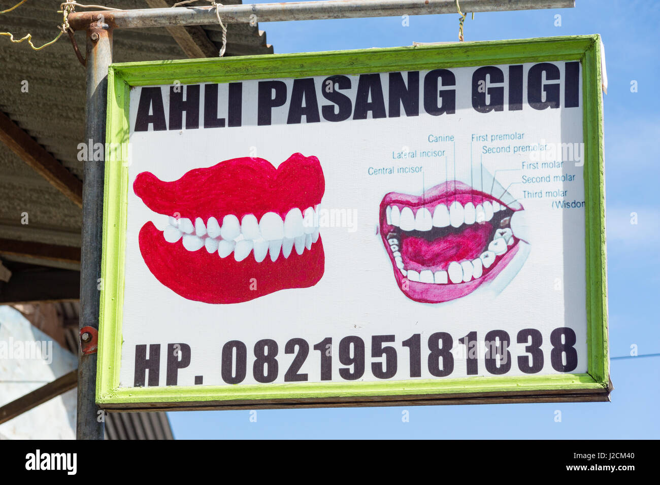 Indonesia, Maluku Utara, Kabupaten Halmahera Utara, sign of a dental ...