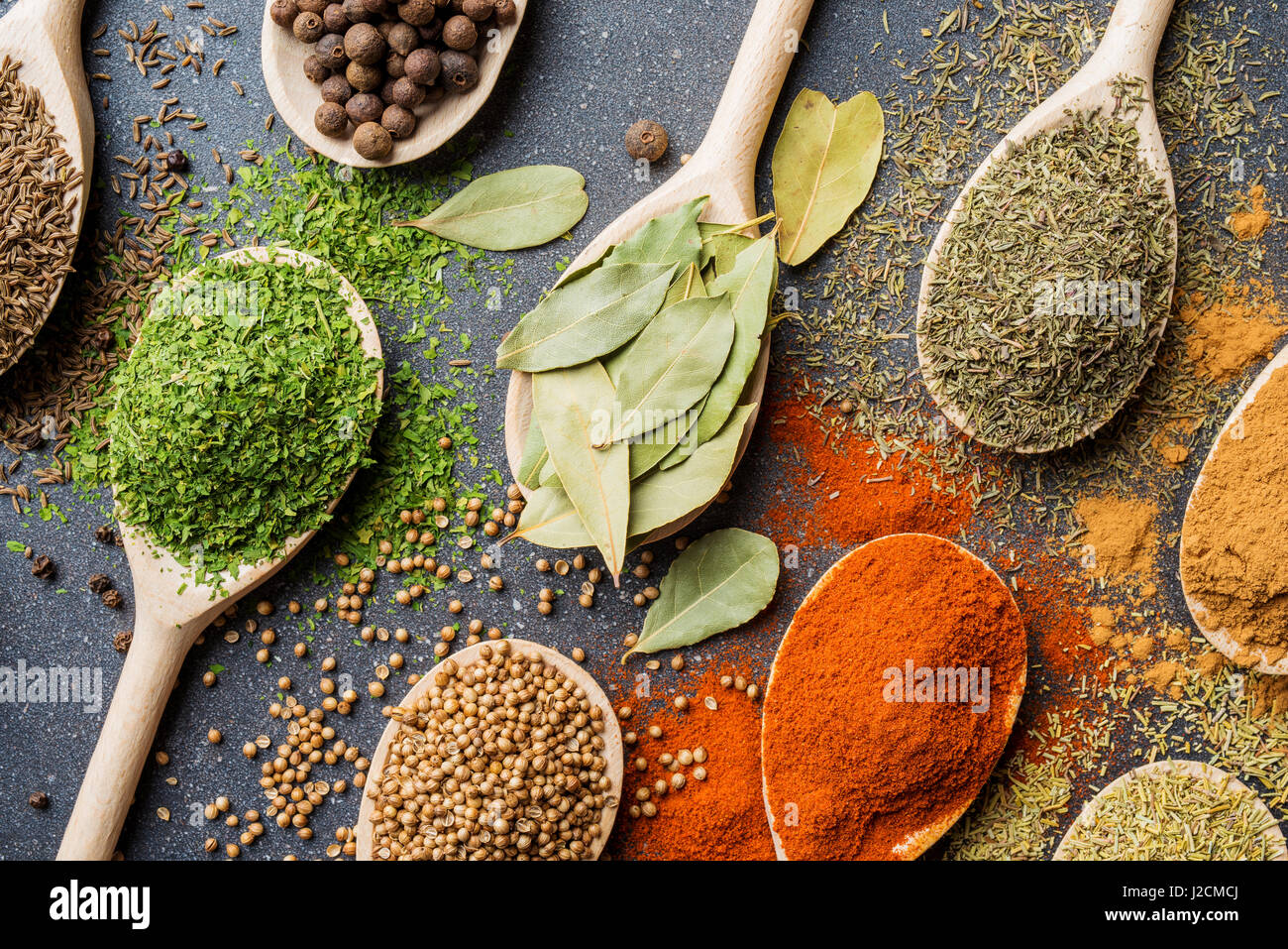 Herbs and spices on gray stone table Stock Photo - Alamy
