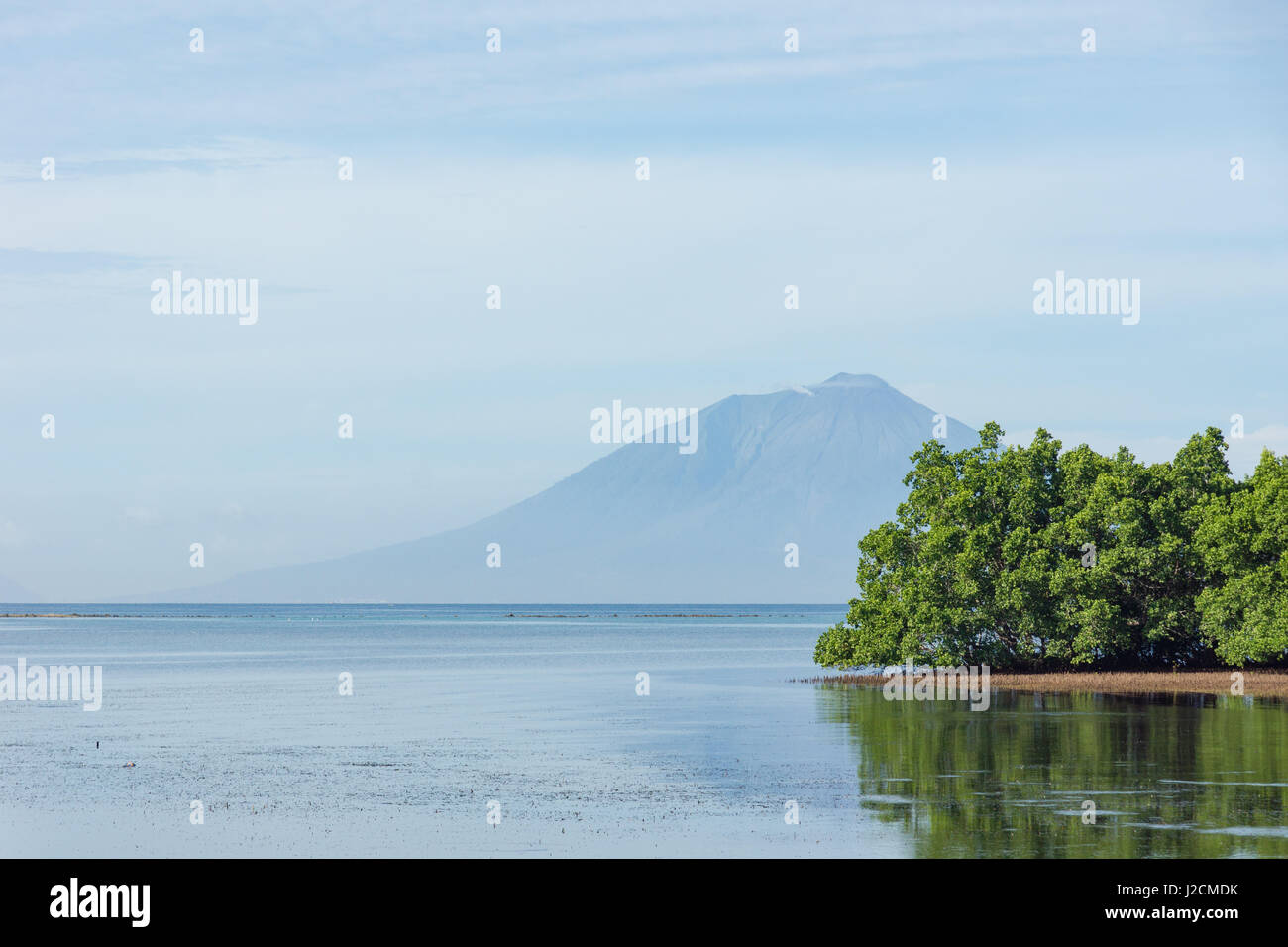 Indonesia, Maluku Utara, Kabupaten Halmahera Barat, volcano at the sea ...