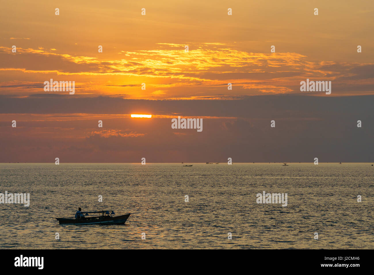 Indonesia, Sulawesi Utara, Kota Manado, Fishing boat at sunset at ...