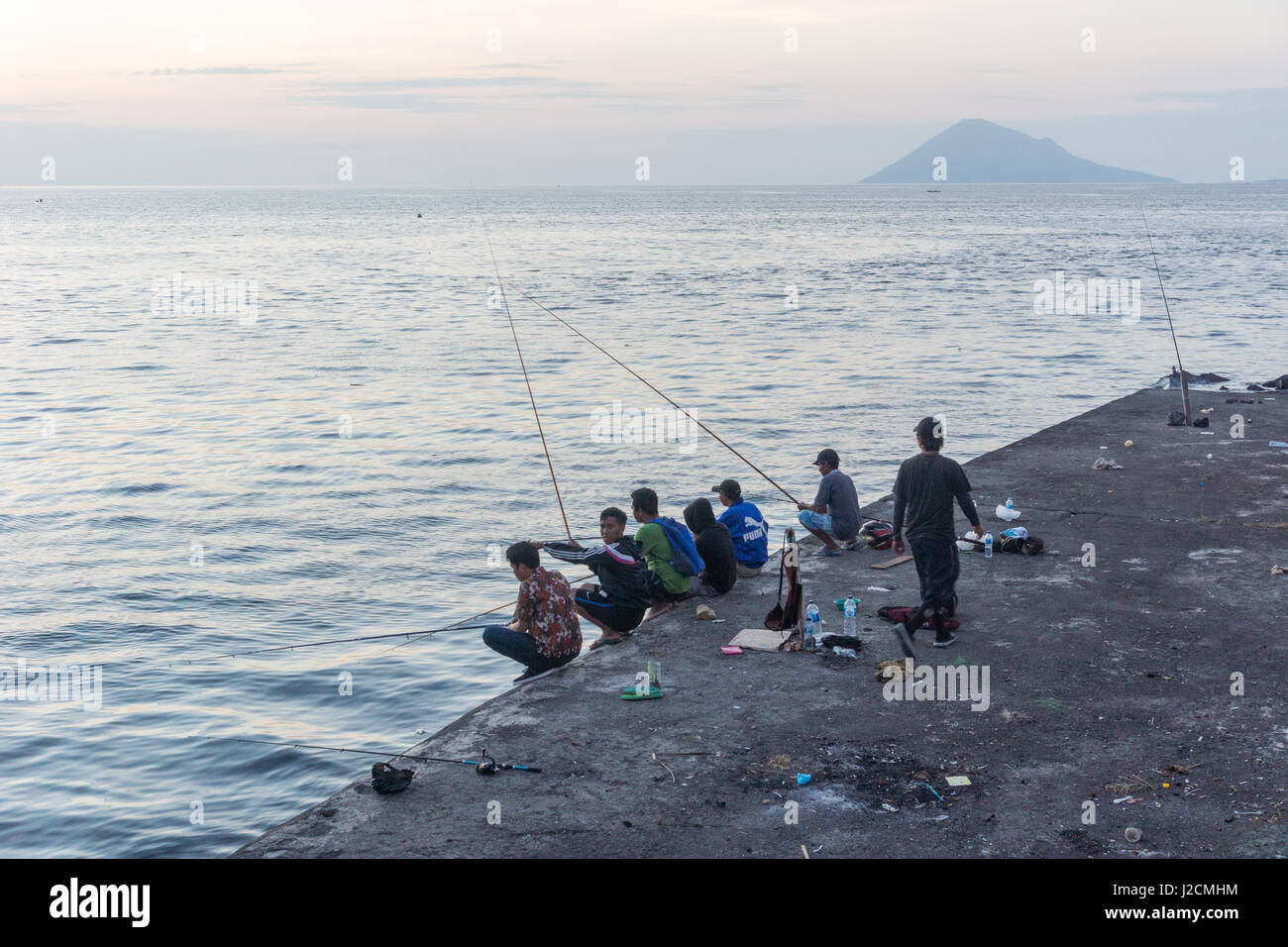 Indonesia, Sulawesi Utara, Kota Manado, local anglers at the sea at ...