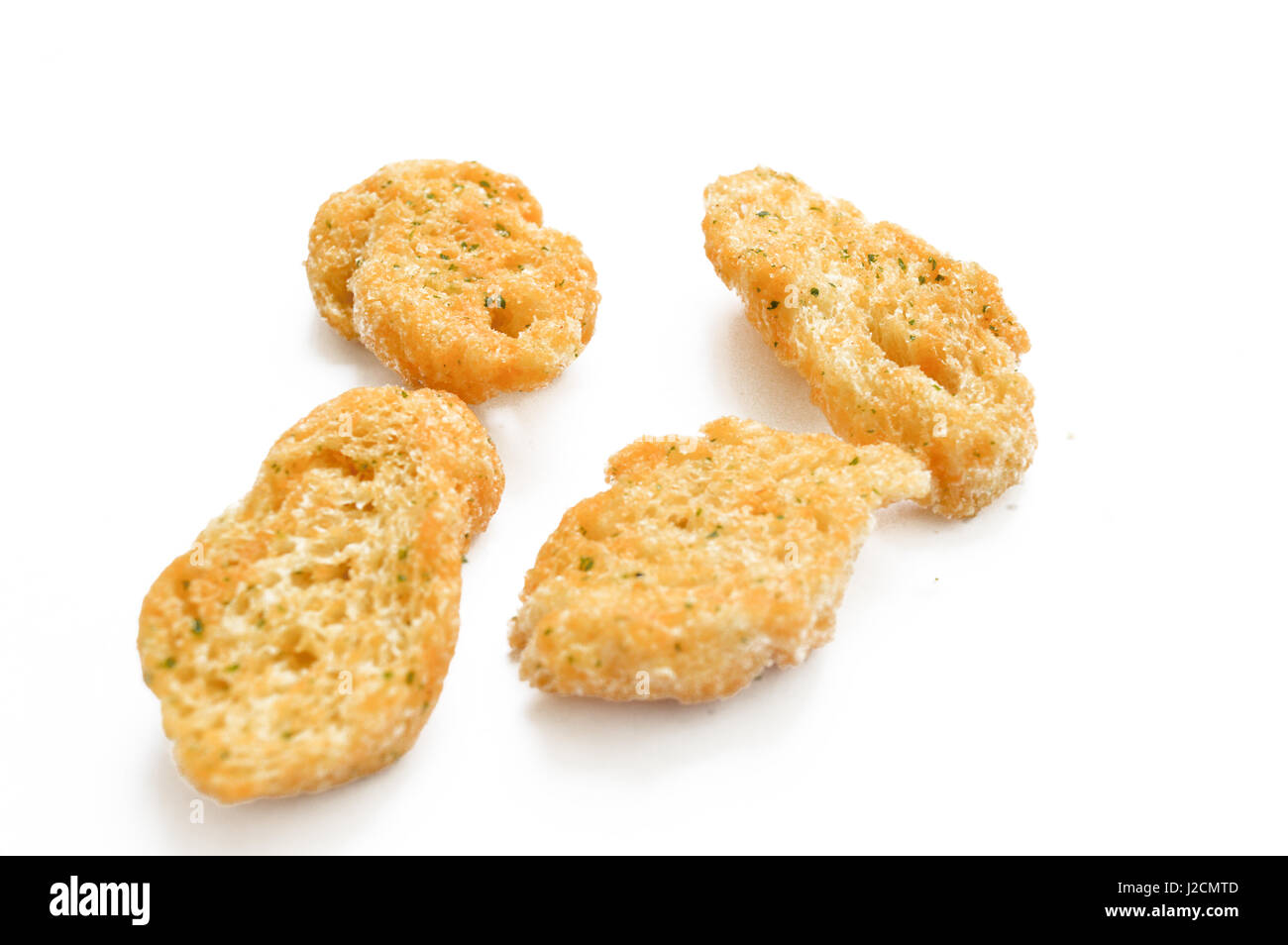 roasted bread bites isolated on white Stock Photo - Alamy