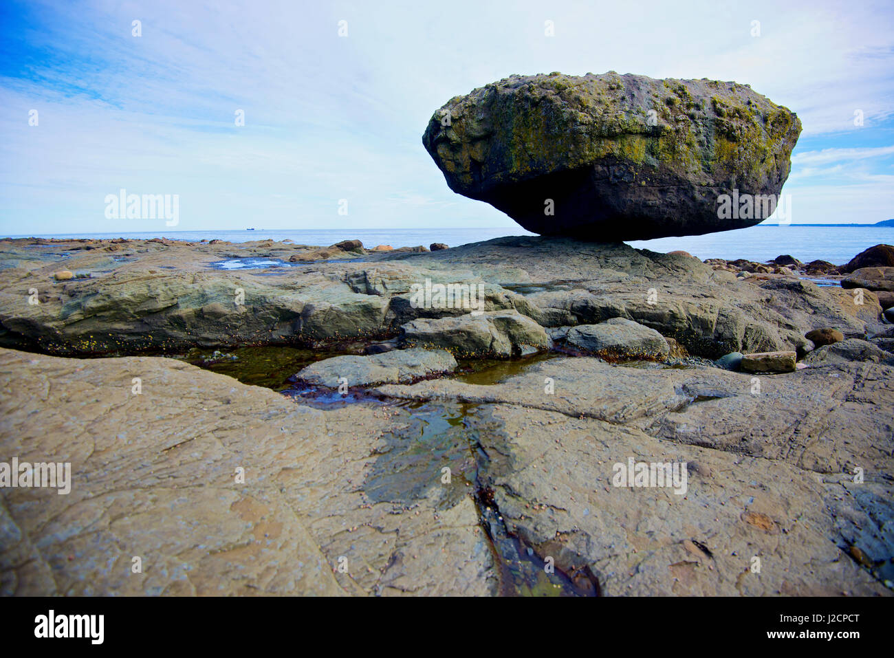 Balance Rock on the east coast of Graham Island. It is a glacial ...