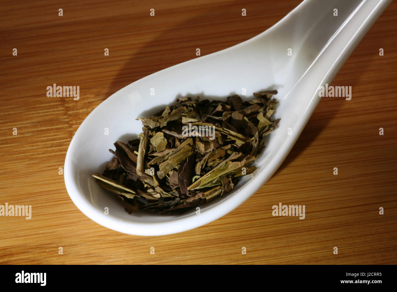 green tea on porcelain spoon Stock Photo - Alamy