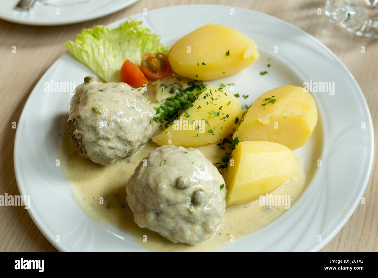 Germany, Berlin. Lunch plate of meatballs and potatoes. Credit as ...