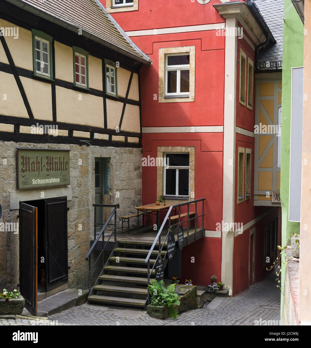 Traditional half-timbered buildings in the village of Schmilka in ...