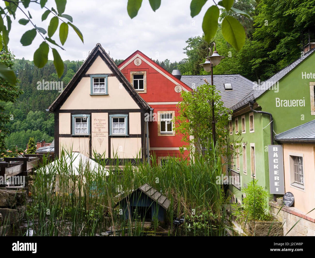 Traditional half-timbered buildings in the village of Schmilka in ...