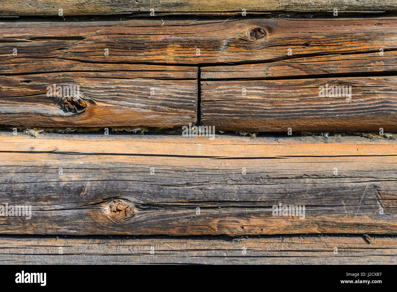 wall made of wooden logs. Brown Wooden Debarked Logs Stock Photo - Alamy