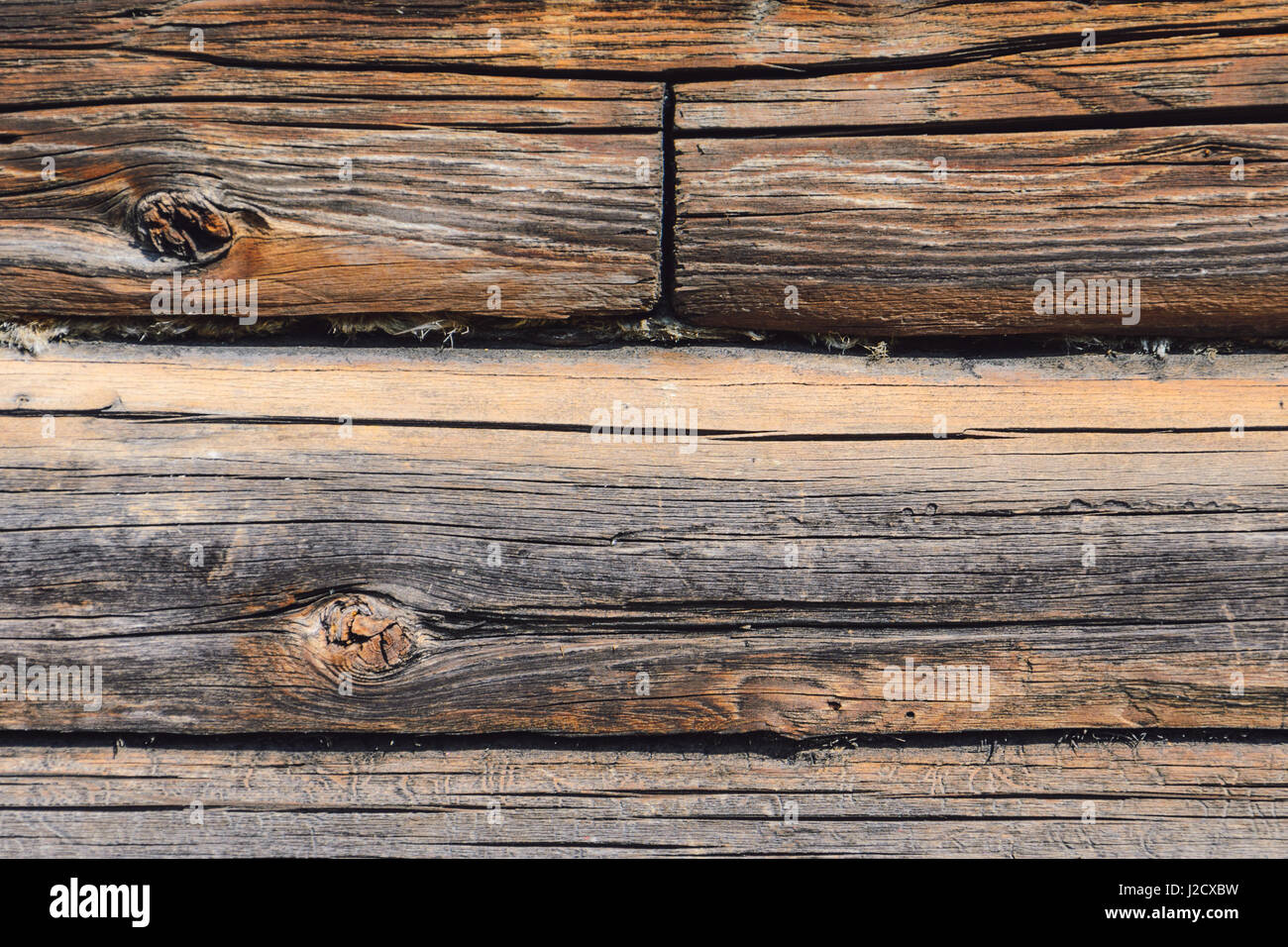 wall made of wooden logs. Brown Wooden Debarked Logs Stock Photo - Alamy