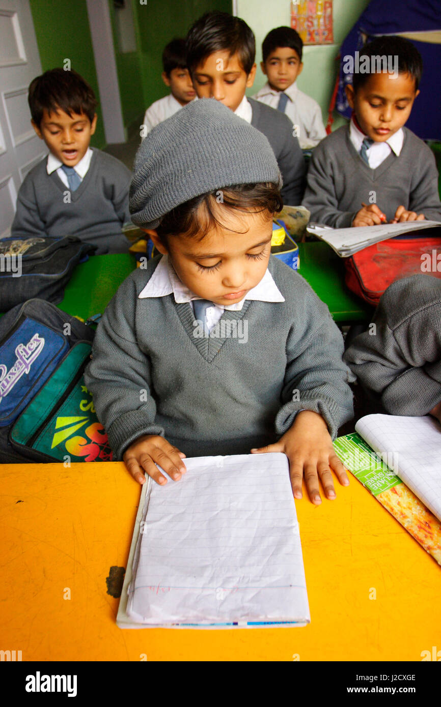 A student in a local school studying in Pakistan Stock Photo - Alamy