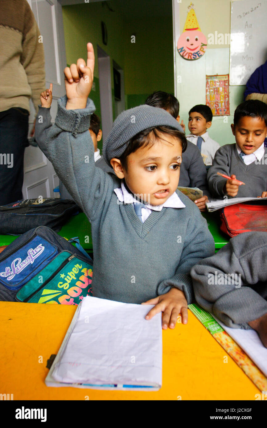 A student in a local school studying in Pakistan Stock Photo - Alamy
