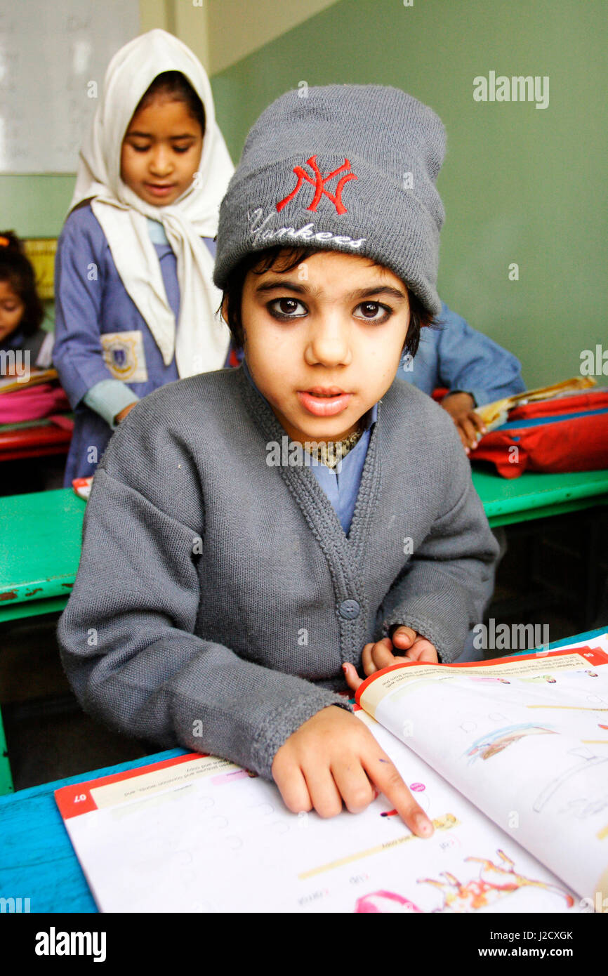 A student in a local school studying in Pakistan Stock Photo - Alamy