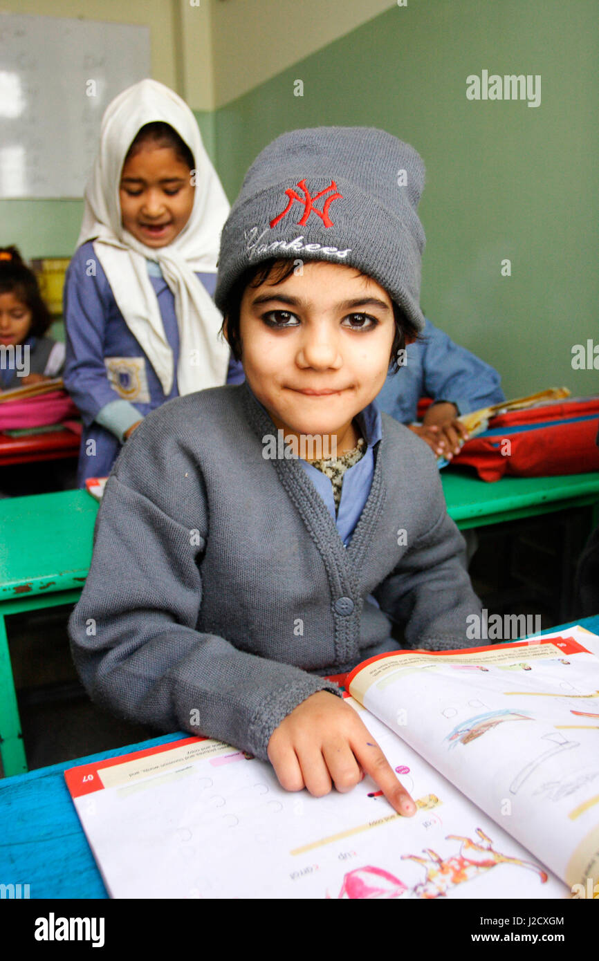 A student in a local school studying in Pakistan Stock Photo - Alamy