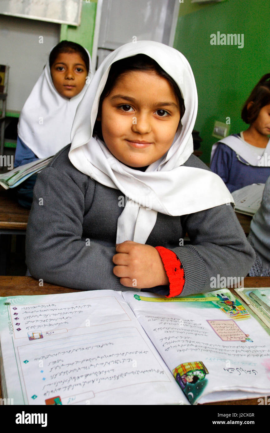 A student in a local school studying in Pakistan Stock Photo - Alamy