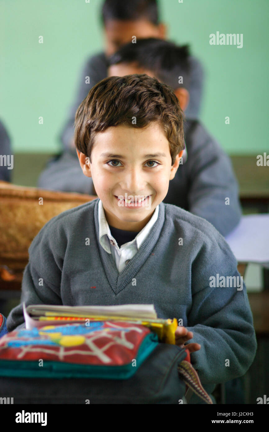 A student in a local school studying in Pakistan Stock Photo - Alamy