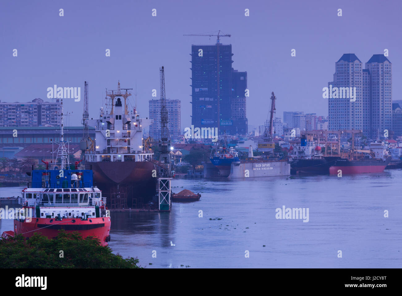 Vietnam, Ho Chi Minh City. Elevated view of Saigon River and shipyard ...