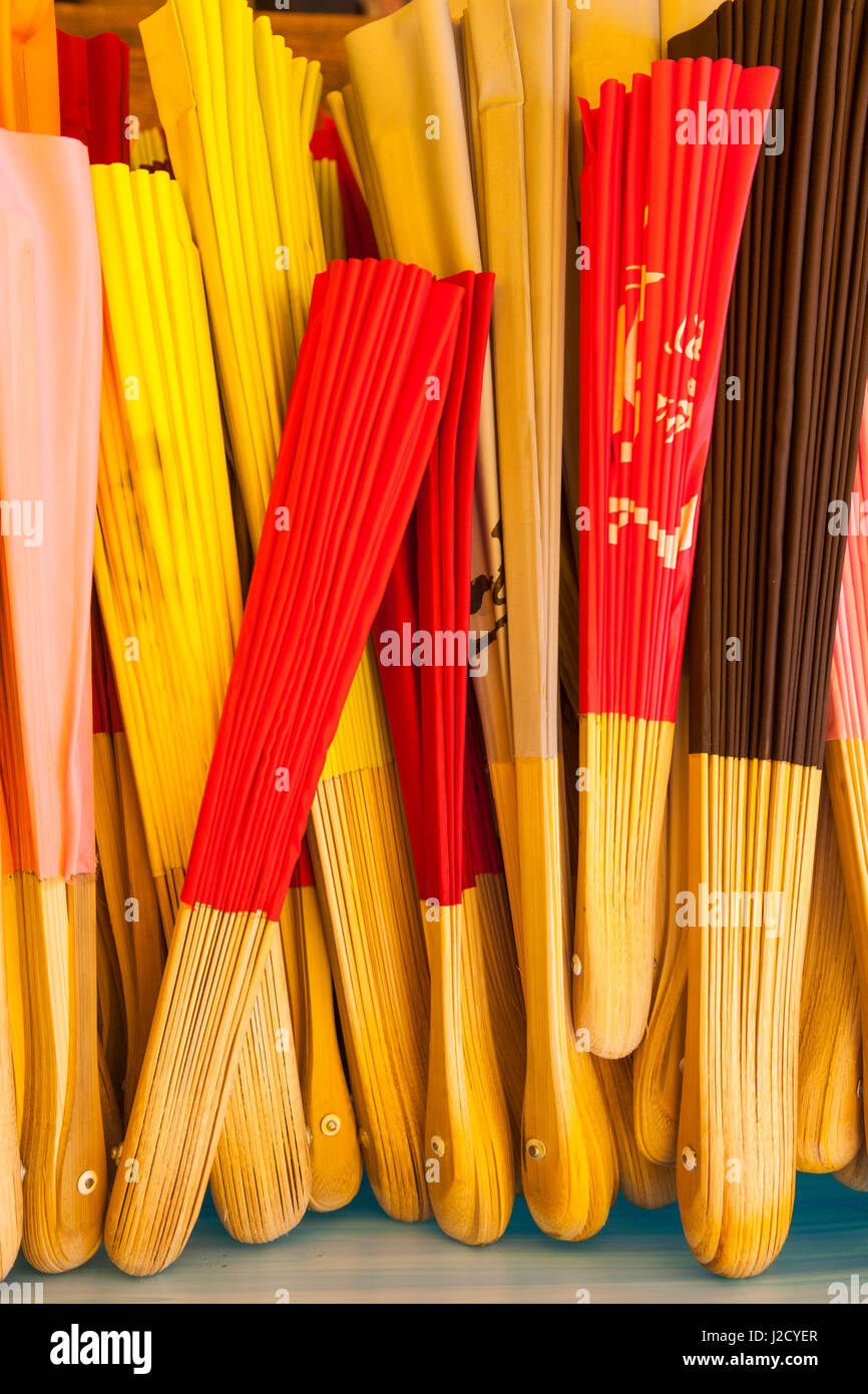 Vietnam, Mekong Delta. My Tho, Vinh Trang Pagoda, souvenir paper fans ...