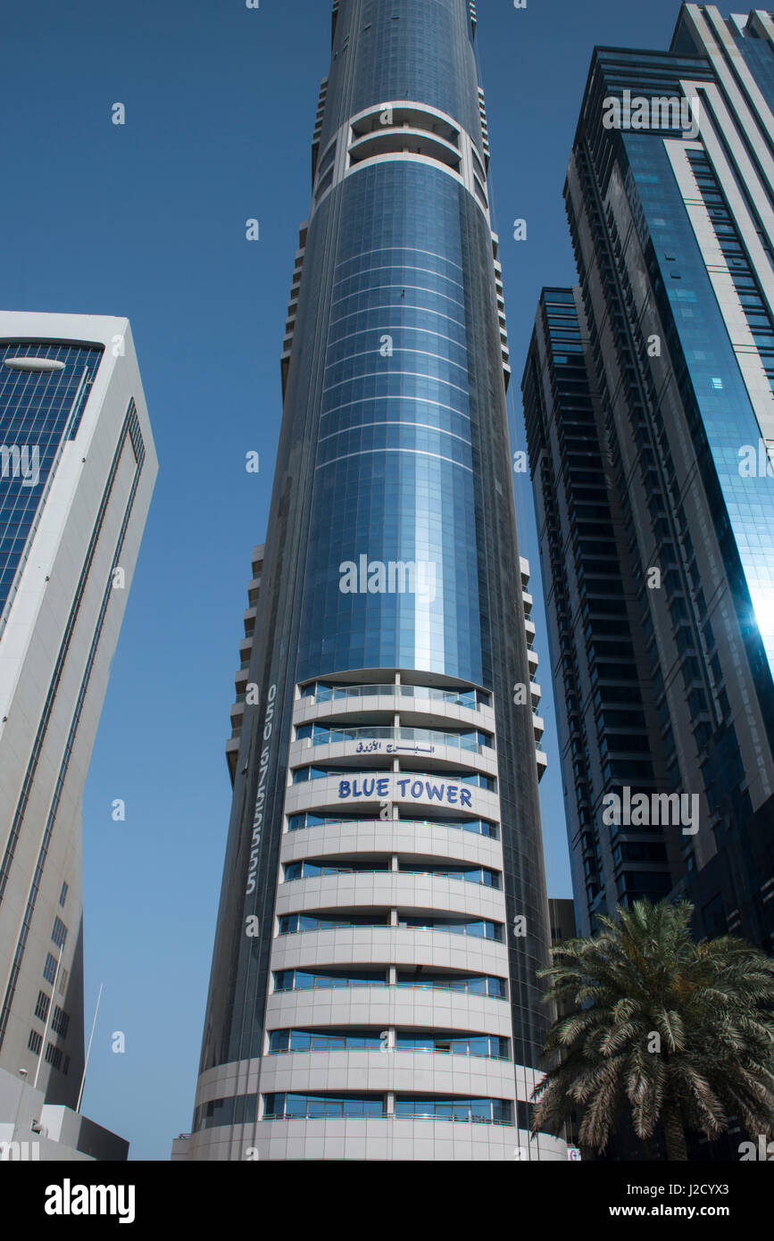 United Arab Emirates, Dubai. Modern downtown Dubai skyline. Blue Tower ...