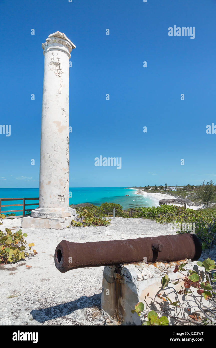 Bahamas, Little Exuma Island. Rusty cannon and column marking salt ...