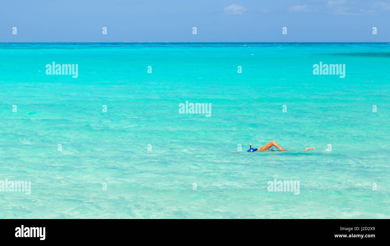 Bahamas, Exuma Island. Ocean swimmer with snorkel. Credit as: Don ...