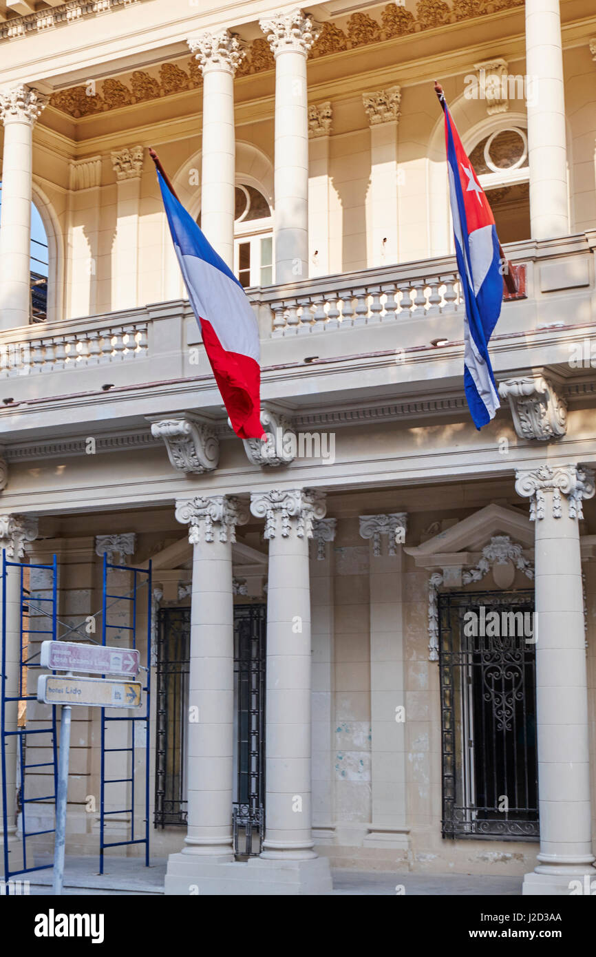 West Indies, Cuba, Havana. French and Cuban flags fly from building ...