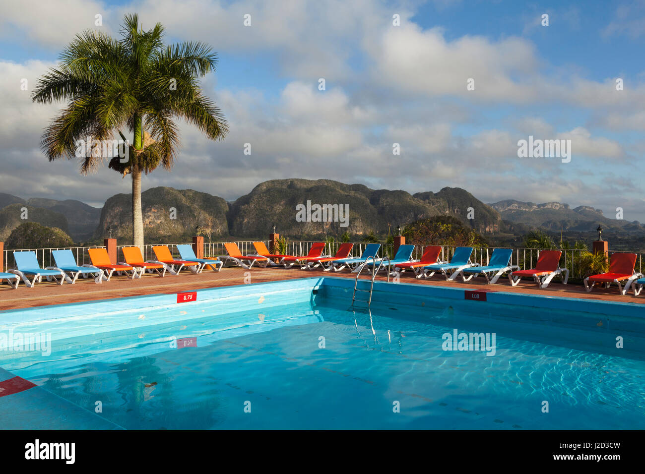Cuba, Vinales. The swimming pool at Jazmines Hotel overlooks the ...