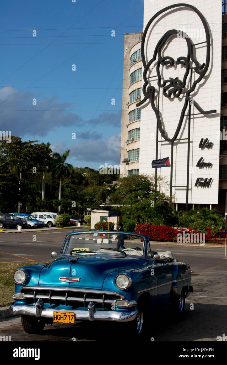 Cuba, Havana, classic convertible and Fidel Castro building in ...