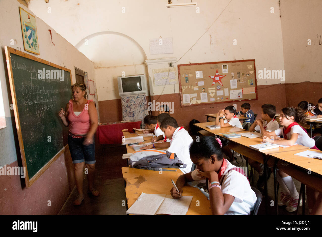 Cuba, Trinidad, children and teacher in elementary school classroom ...