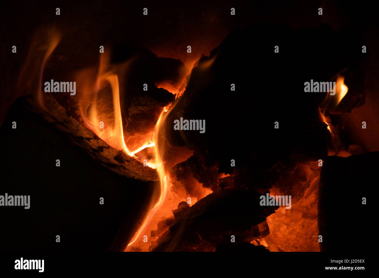 Flames in an open fire Stock Photo - Alamy