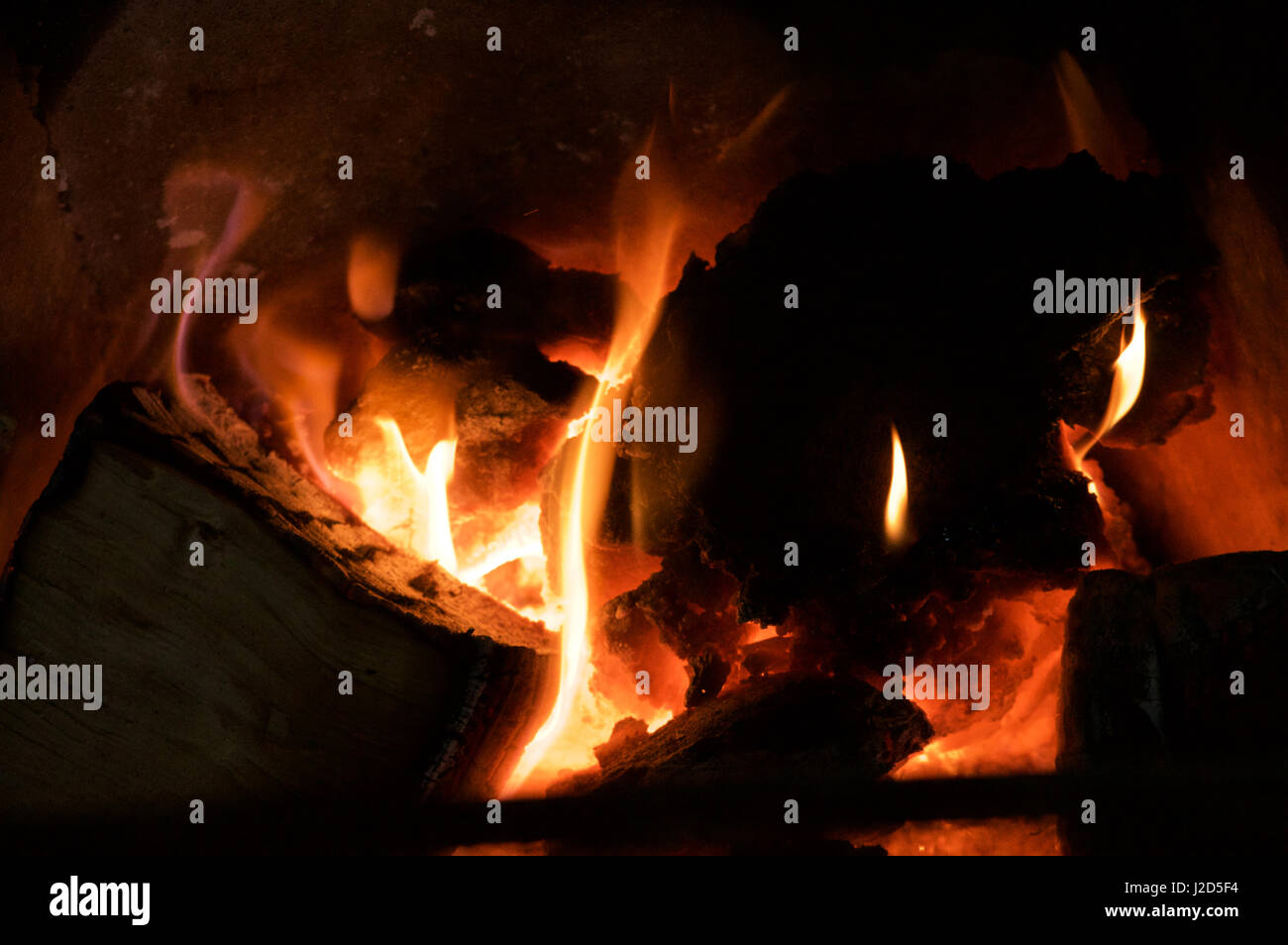 Flames in an open fire Stock Photo - Alamy