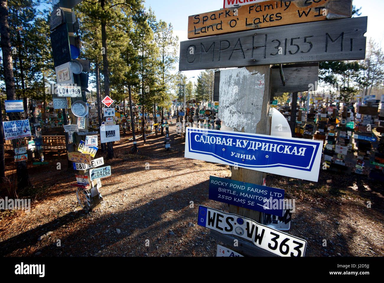 The Yukon's Watson Lake Sign Post Forest, begun in the 1940s when US ...