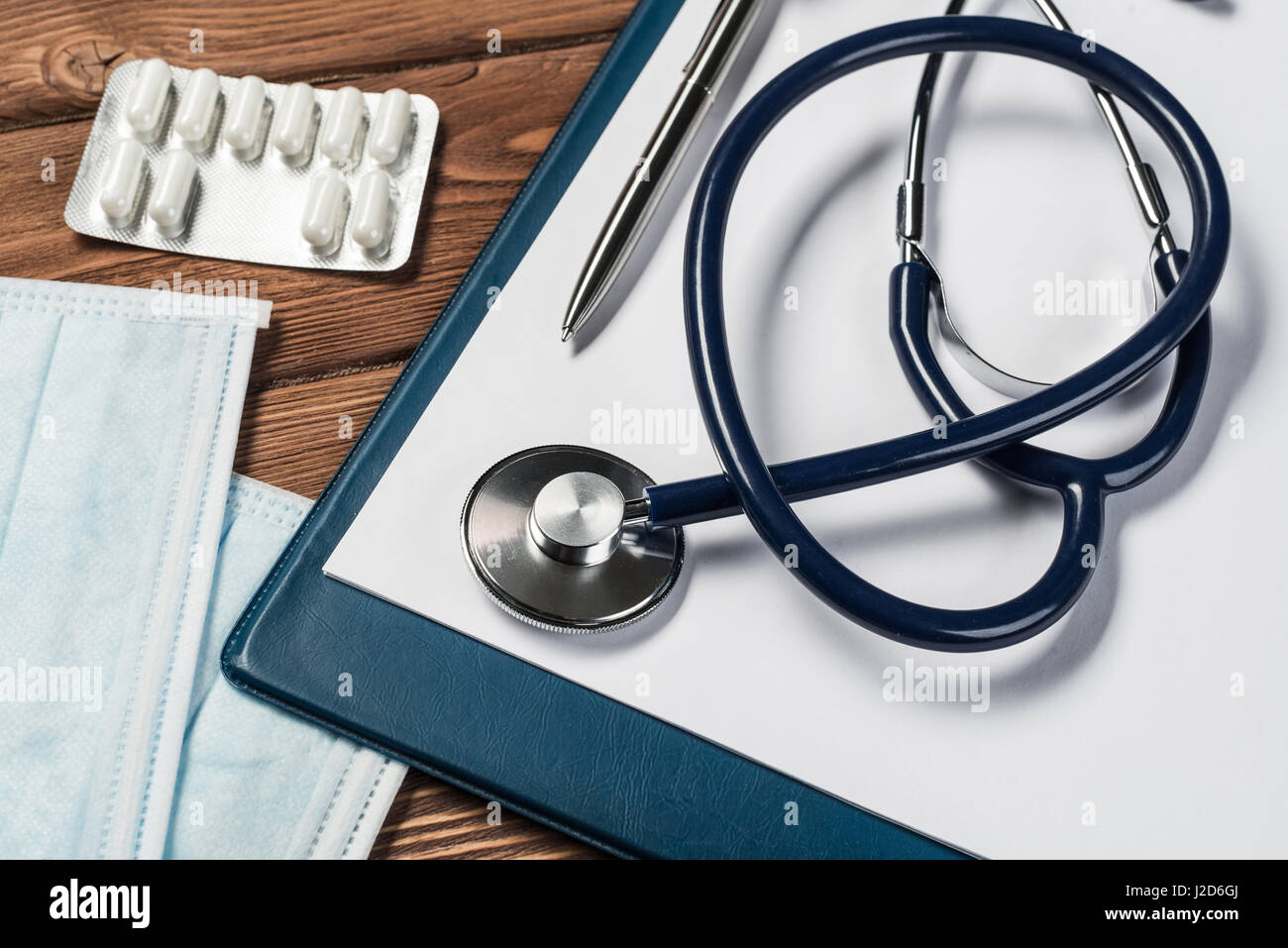 Desk of doctor with medicine things Stock Photo - Alamy