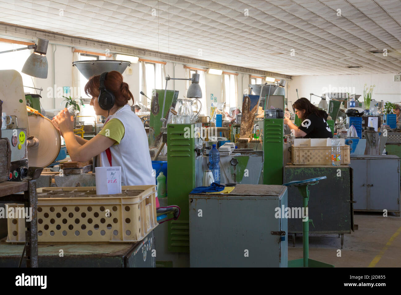 Czech Republic, Nizbor. Ruckl Crystal Factory. Workers cutting patterns ...