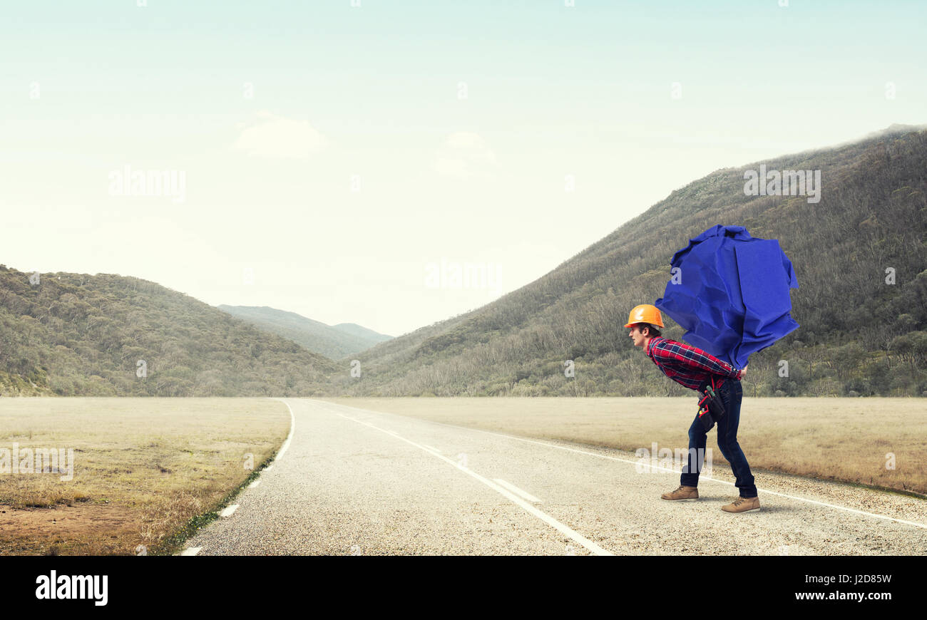 Engineer man carry load Stock Photo - Alamy