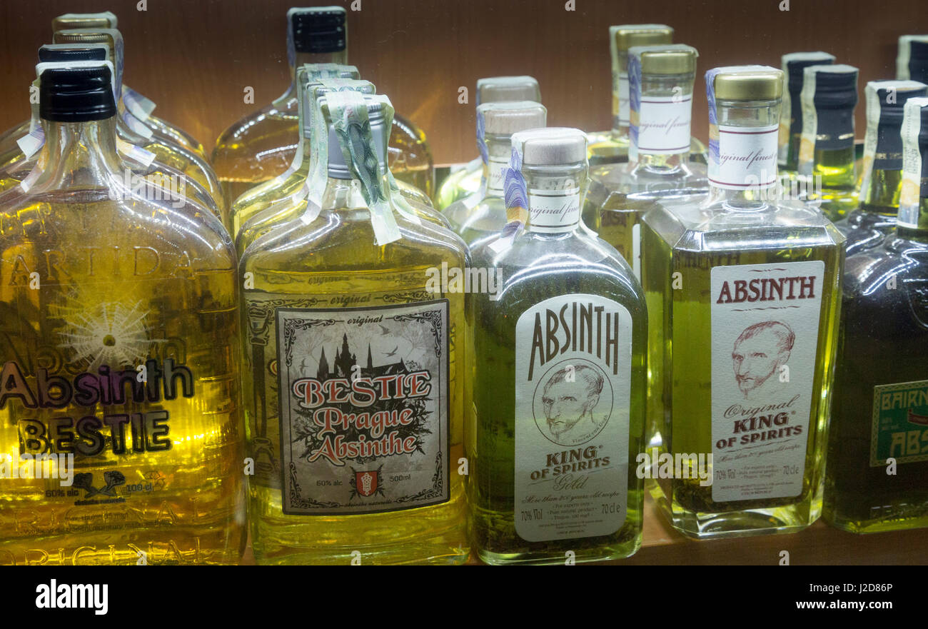 Czech Republic, Prague. Selection of absinthe in store window at night ...