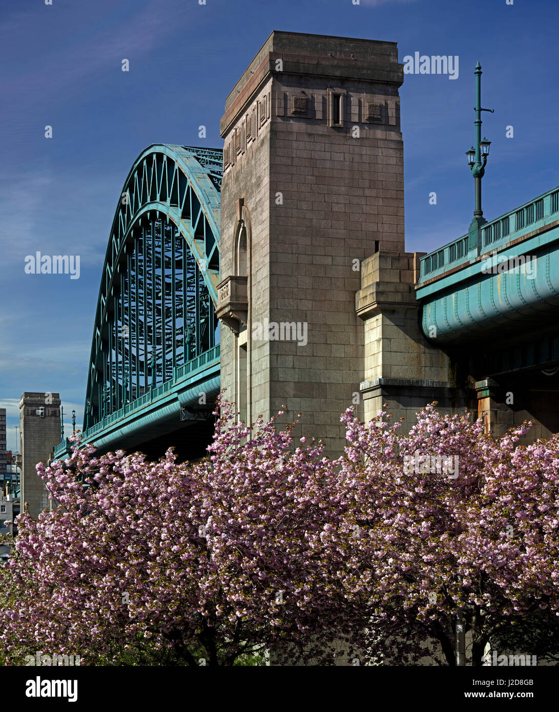 A daytime view of the Tyne Bridge against a summer-time blue sky in ...