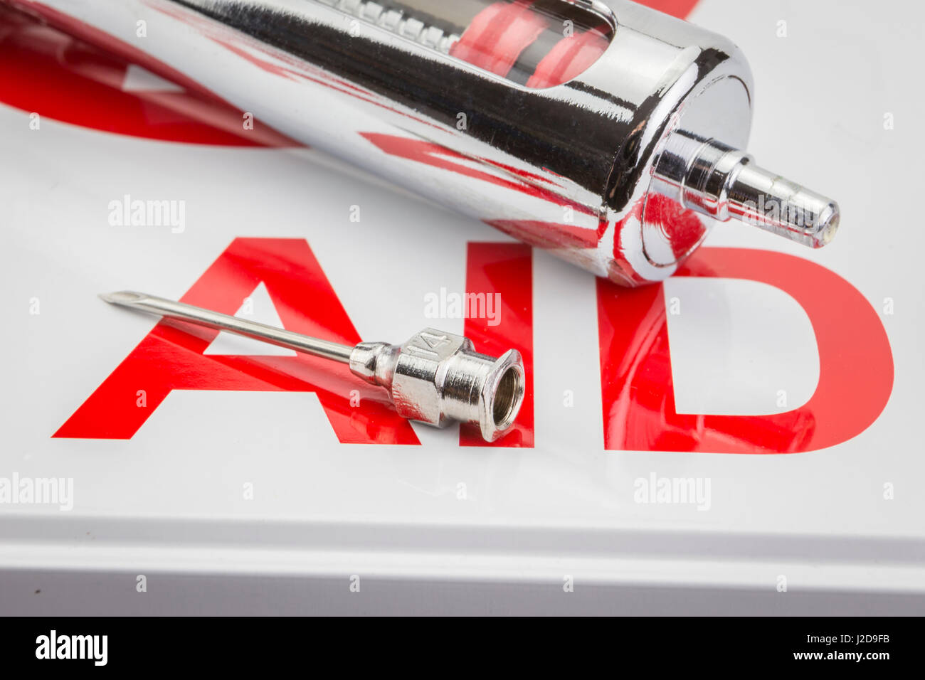 Special syringe and needle on a first aid kit, concept of sanitary ...