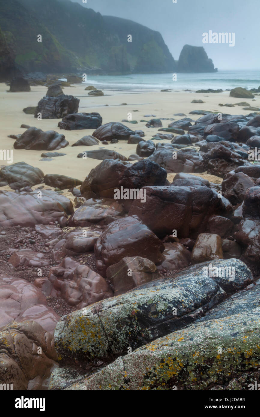red rocks on the beach below the cliffs at Rue Redih lighthouse, Wester ...