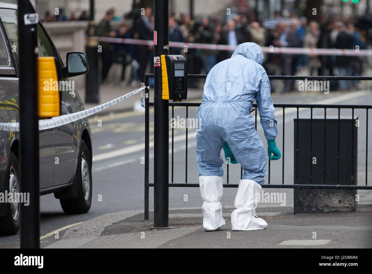 As police officers carry out their investigation hi-res stock ...