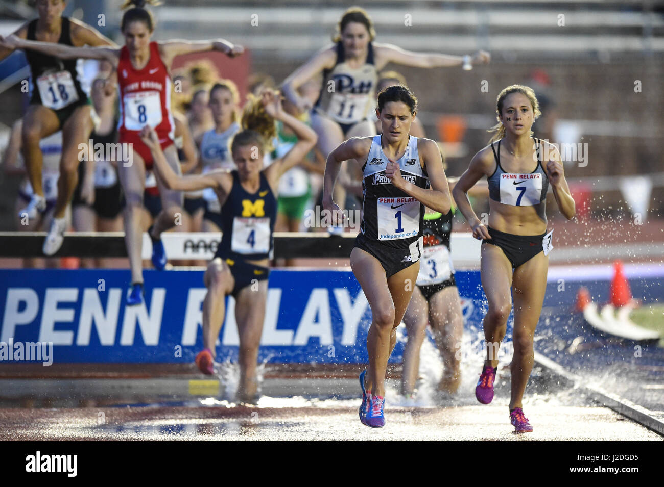 April 27, 2017 The leaders of the women's 3000 steeplechase jump into ...