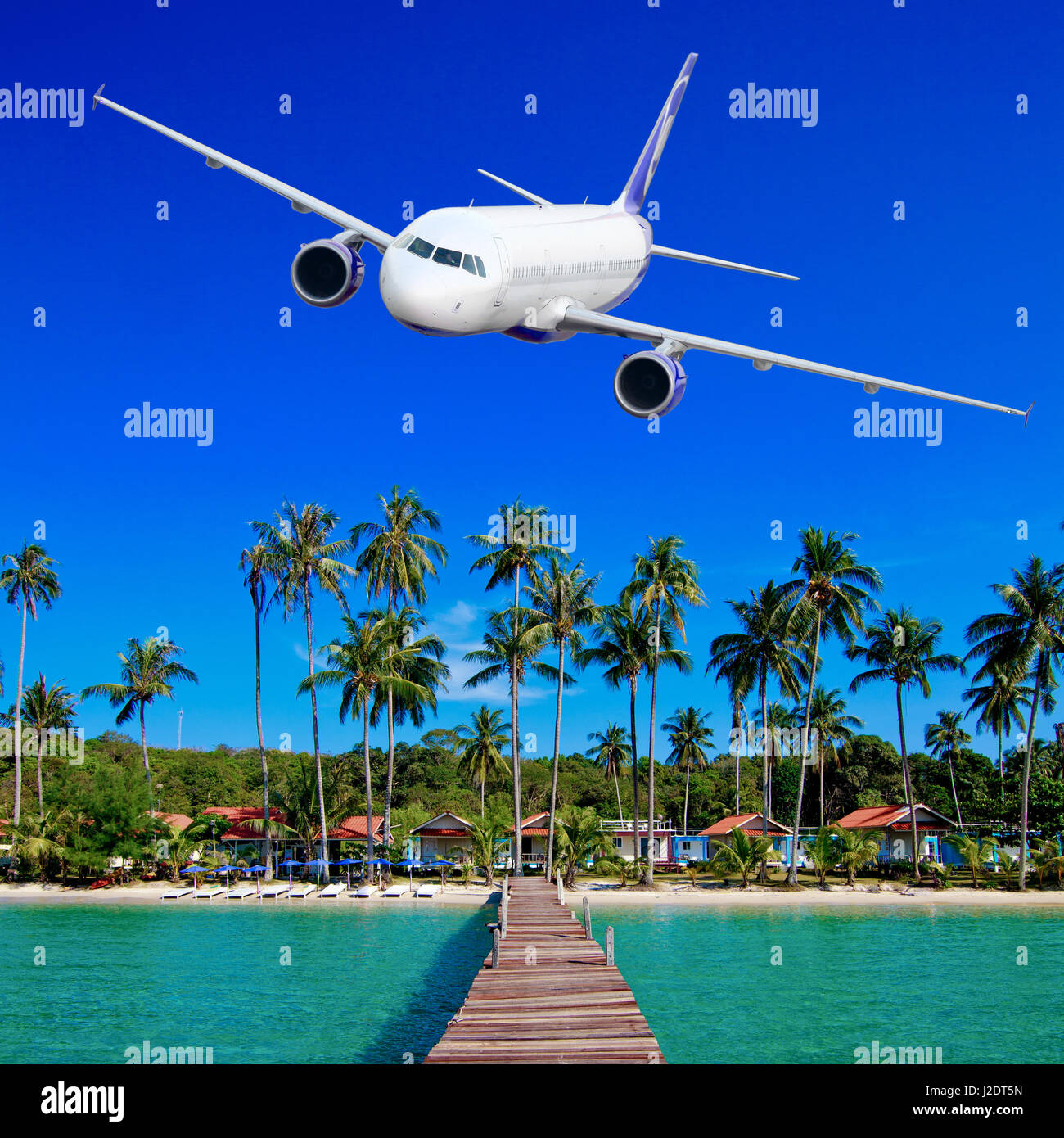 Jet plane over the tropical sea Stock Photo - Alamy