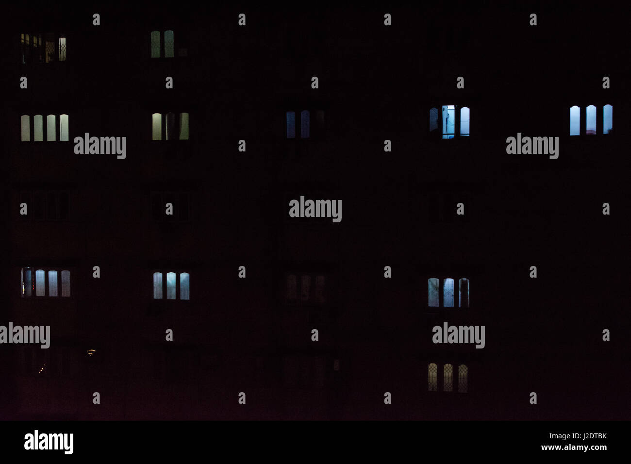 Dim lights from apartment windows at night in Yangon 2 Stock Photo - Alamy