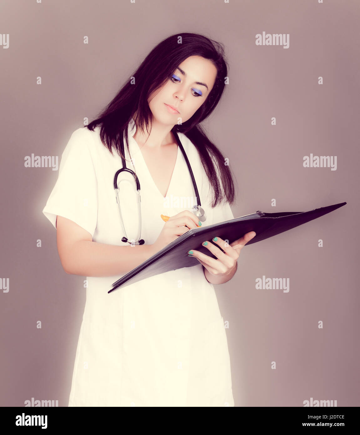medical doctor woman with stethoscope. A female doctor with a folder ...