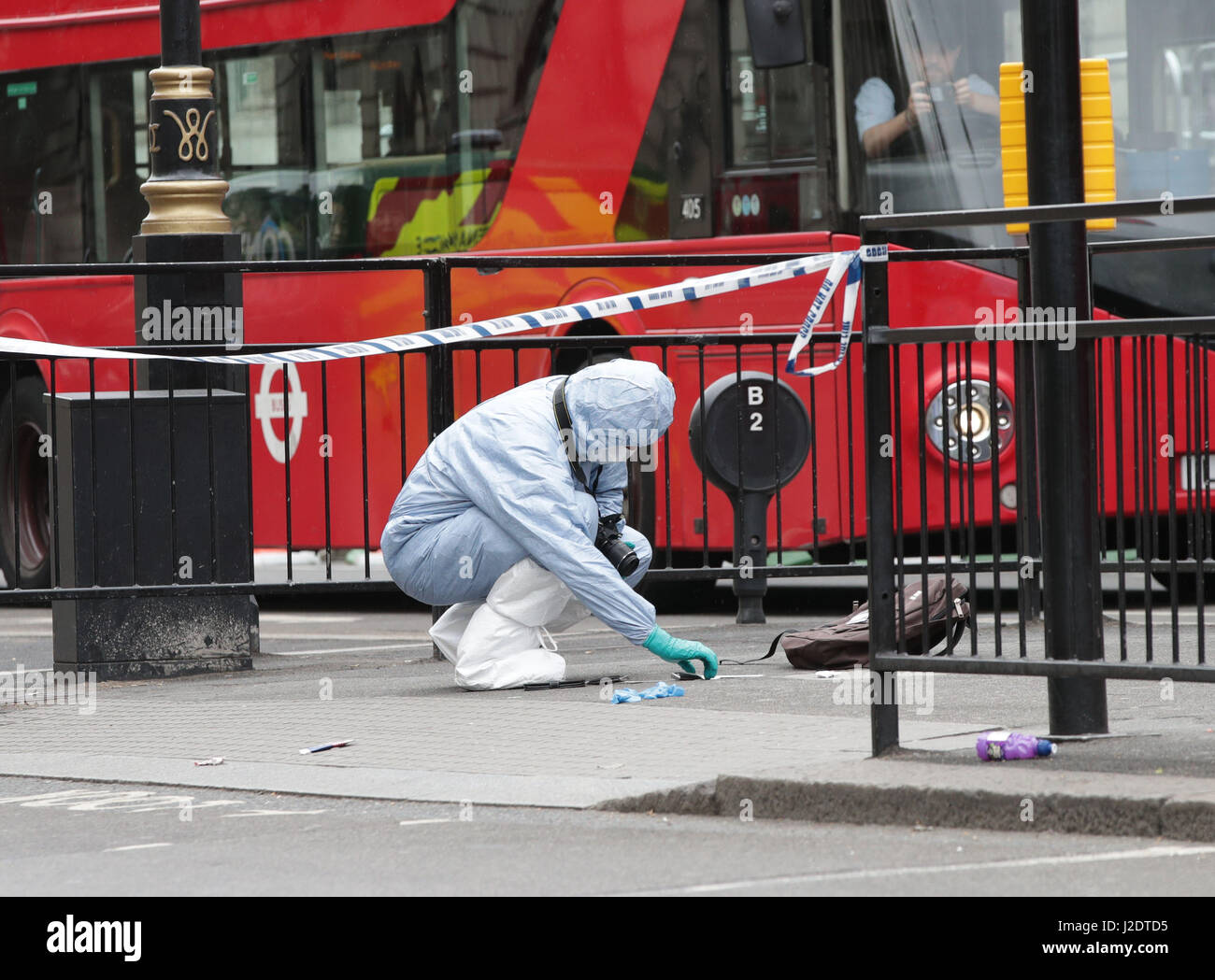 Forensic Officers looking at with knifes at the scene after a man was ...
