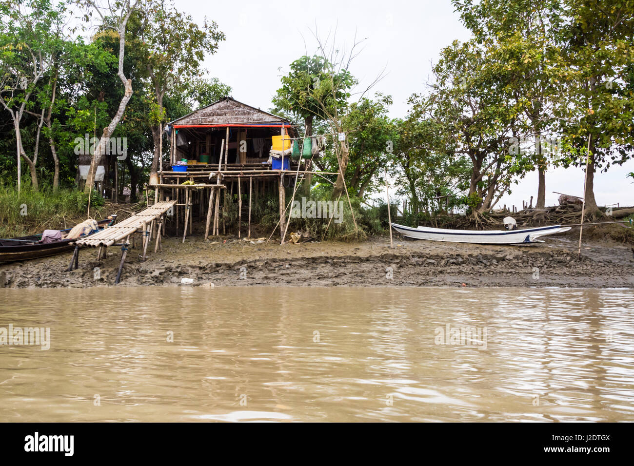House of fisherman on a riverbank in Myanmar 2 Stock Photo - Alamy