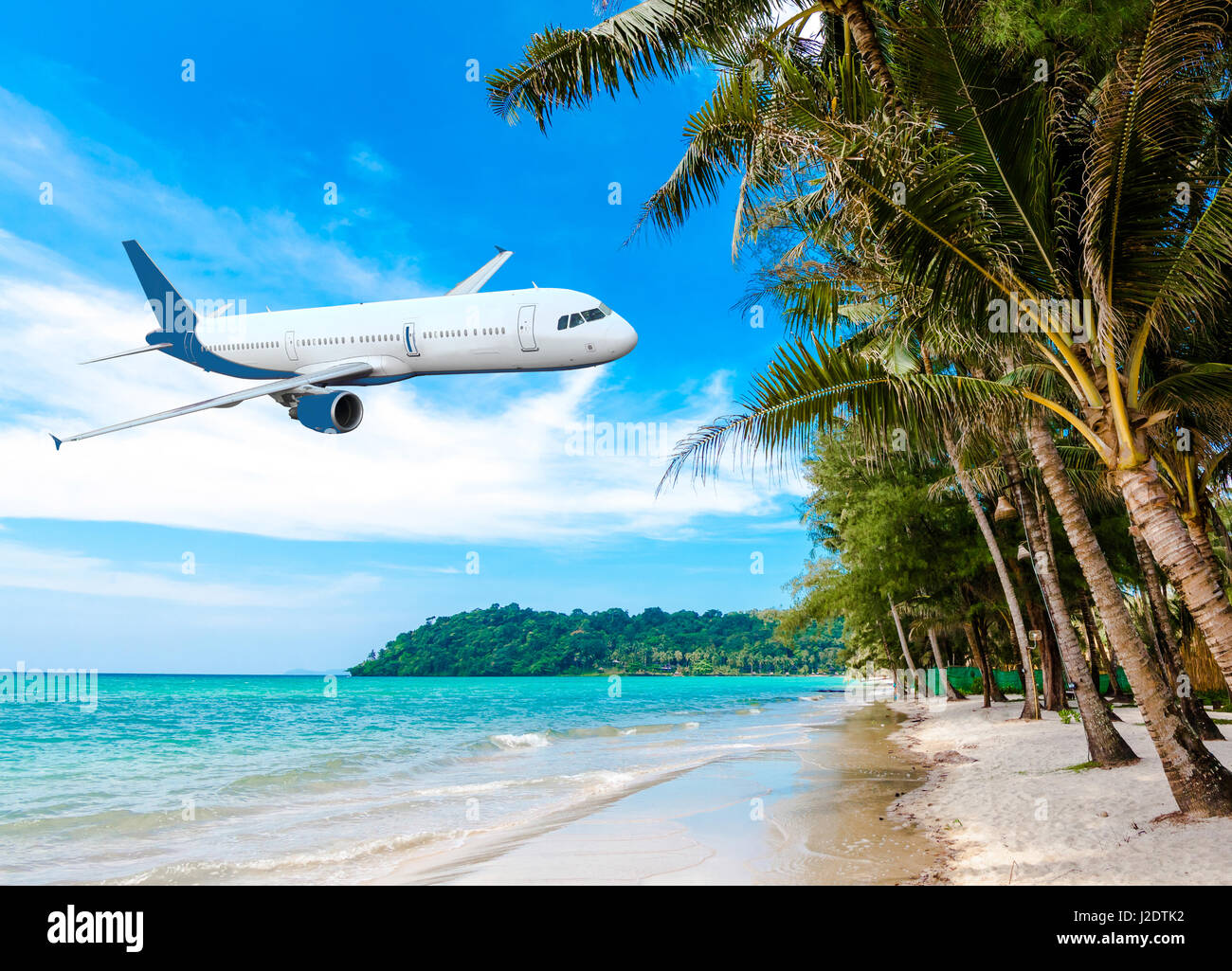 Jet plane over the tropical sea Stock Photo - Alamy