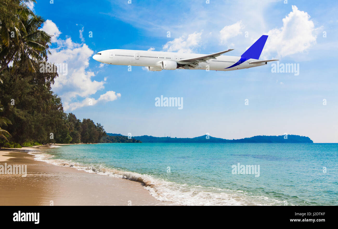 Plane fly over ocean Stock Photo - Alamy