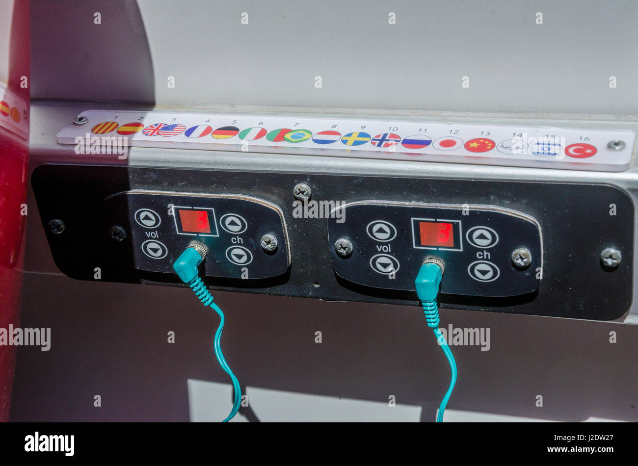 Controls on a guided tour bus where you plug in a set of headphones and ...