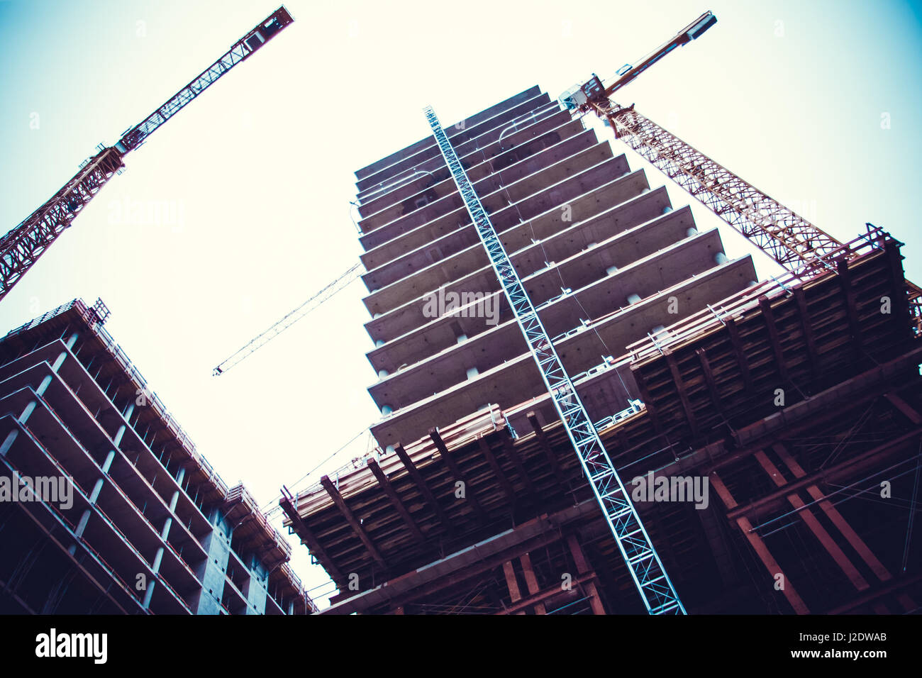 Crane and building construction. big building construction Stock Photo ...